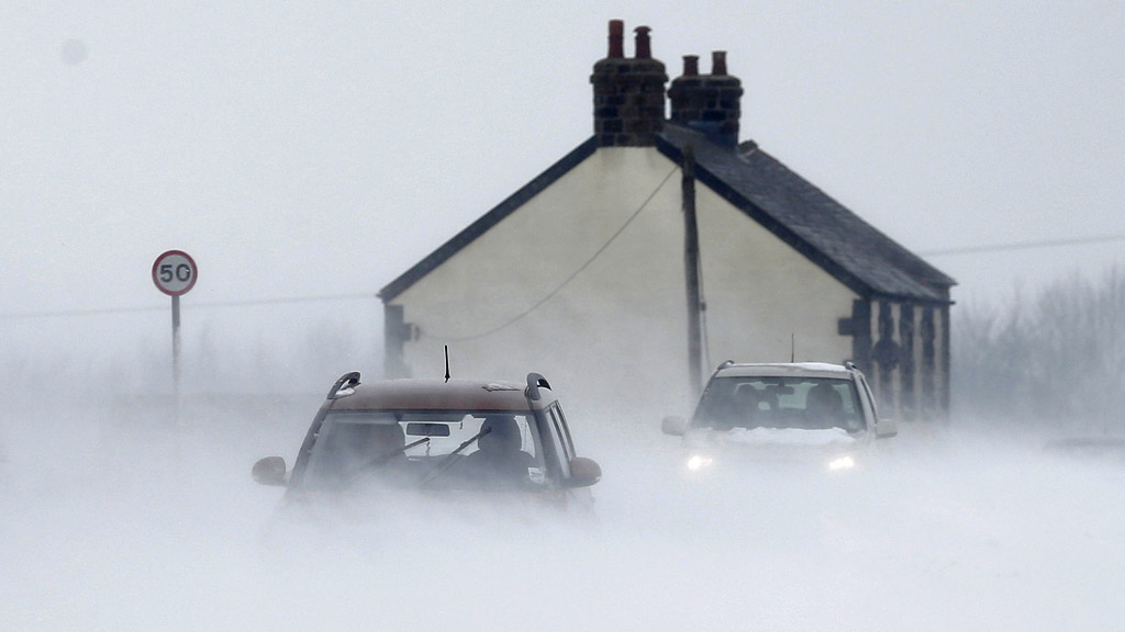 Woman dies as snow and floods batter Britain – Channel 4 News