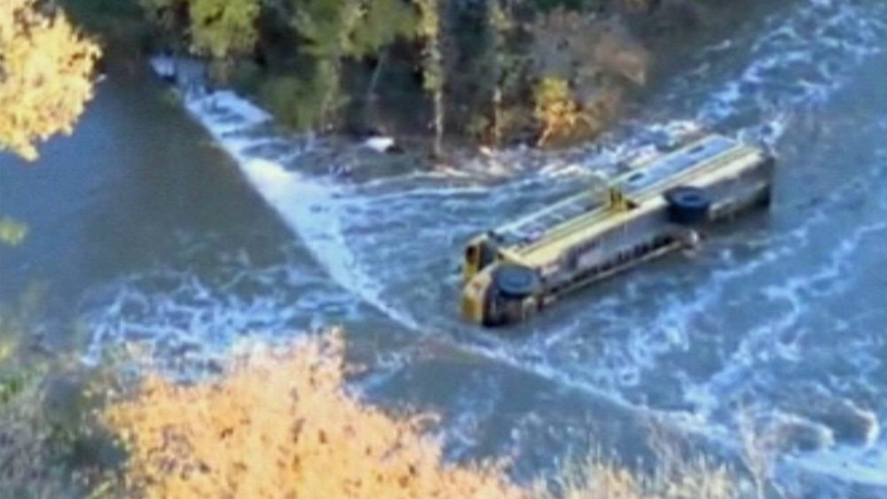 US school bus falls off bridge into creek – Channel 4 News