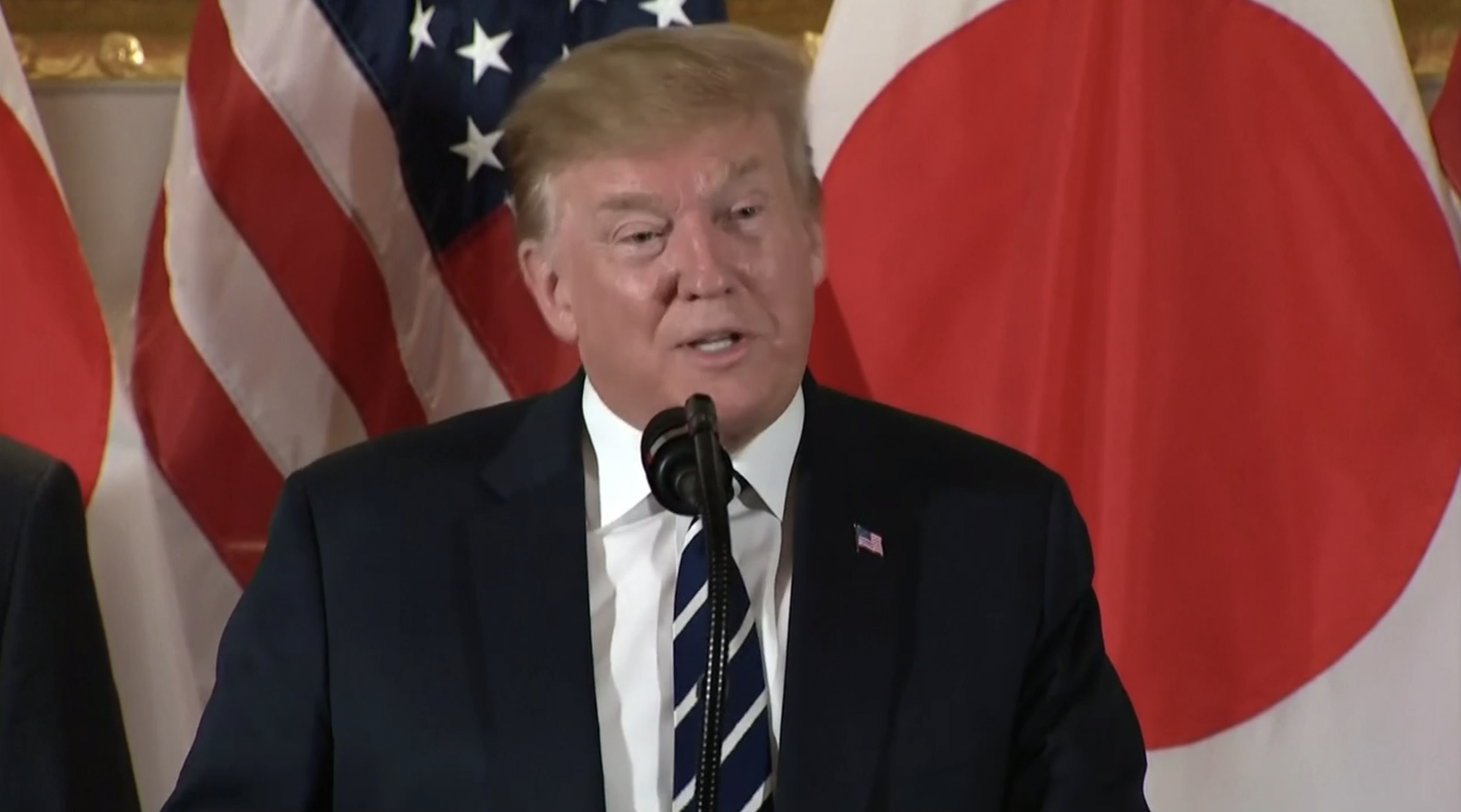 Trump in Japan amid new trade deficit deal – Channel 4 News