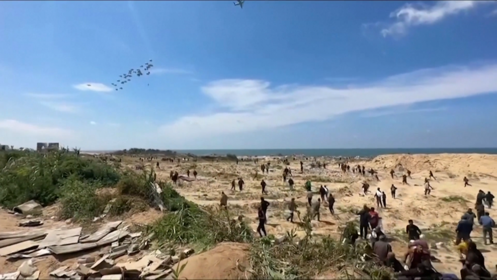 Gaza airdrop tragedy: 12 drown recovering aid from sea – Channel 4 News